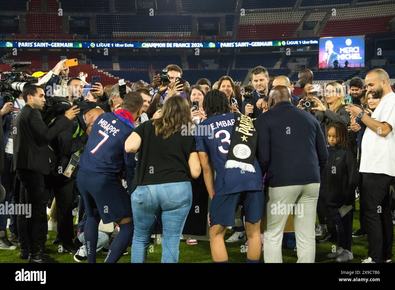 Football match, MBAPPE' family seen from behind from left to right ... Football match, MBAPPE' family seen from behind from left to right ...