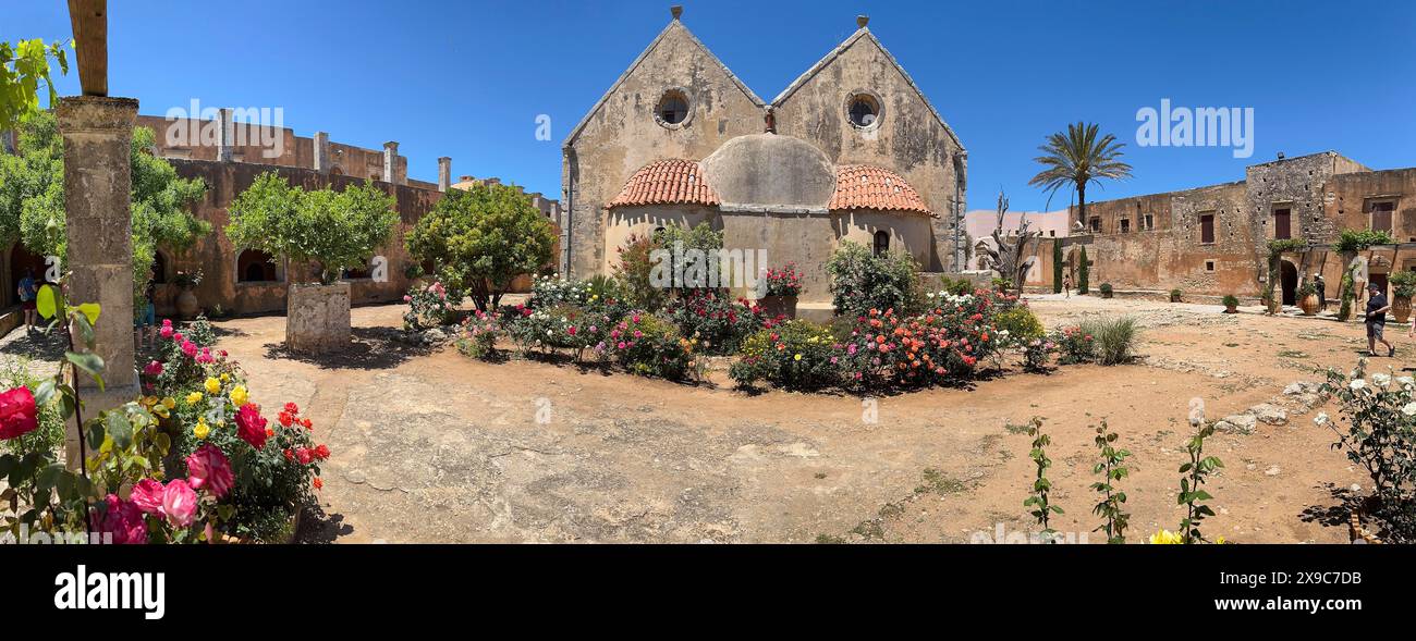 Panoramic photo of monastery courtyard with view of back wall of double ...