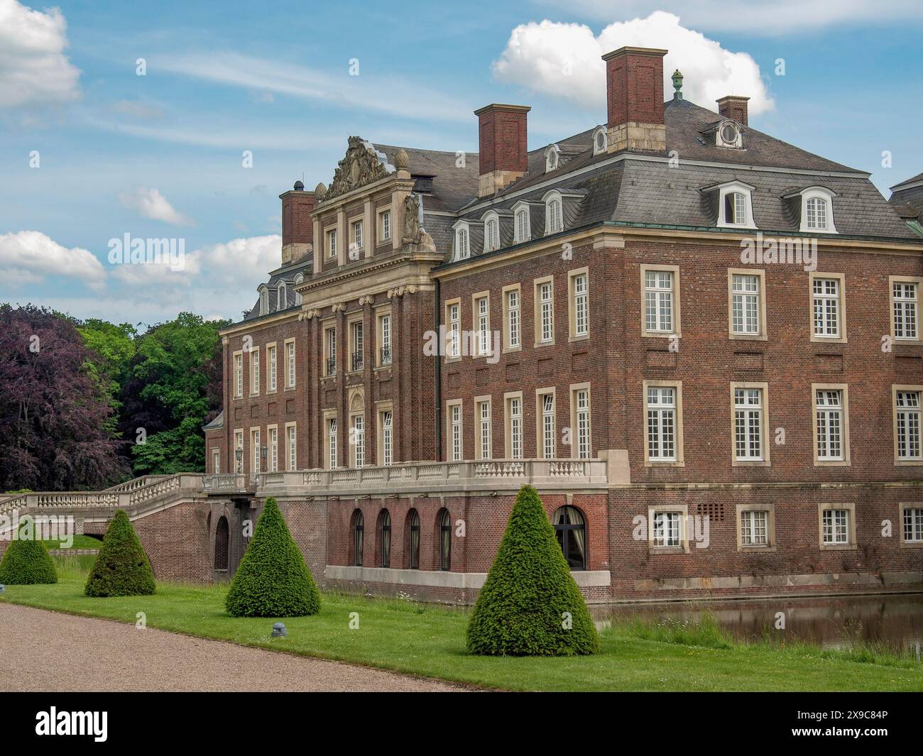 A magnificent historic brick castle, surrounded by green countryside ...