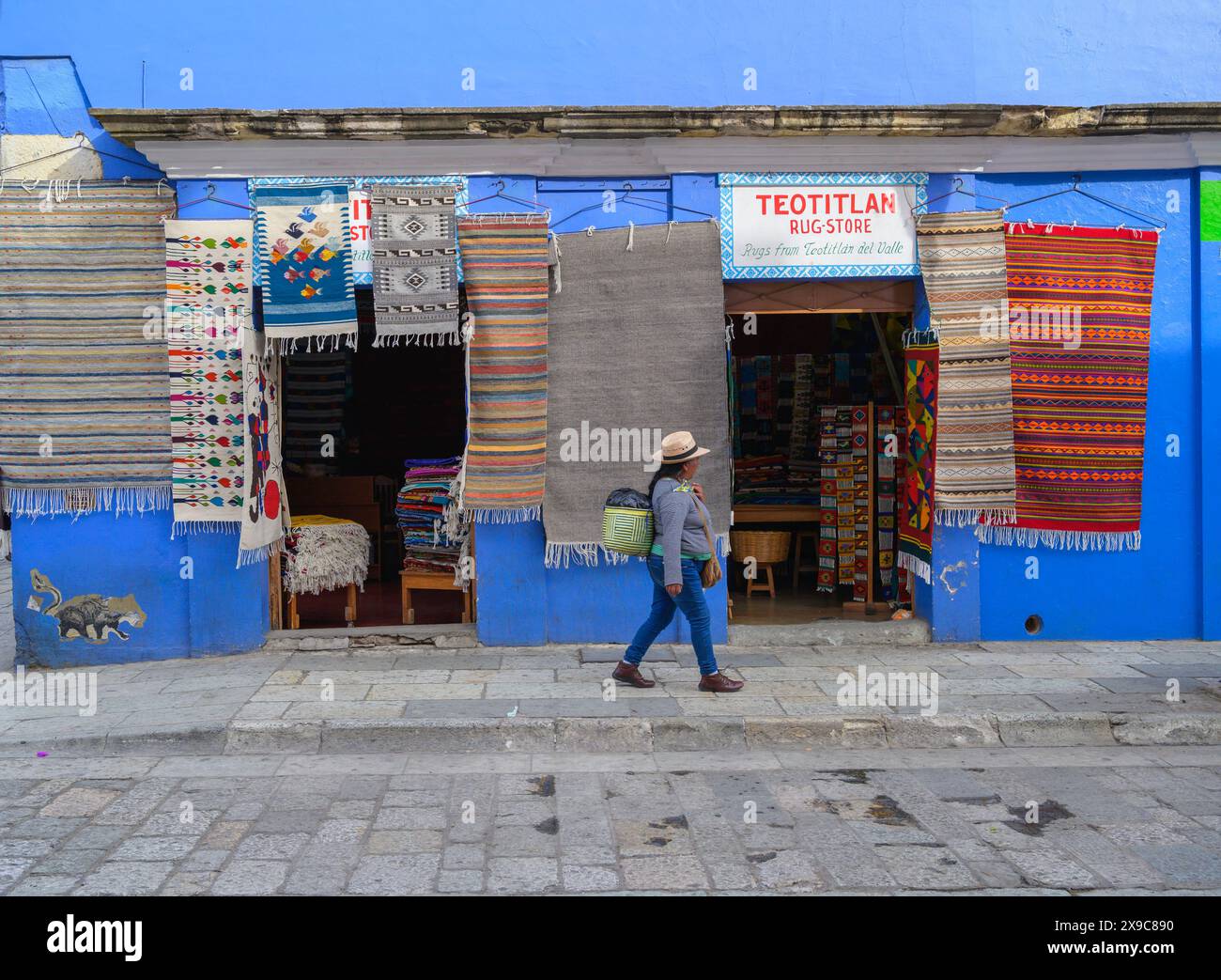 Woman passing artisan carpet hi-res stock photography and images - Alamy