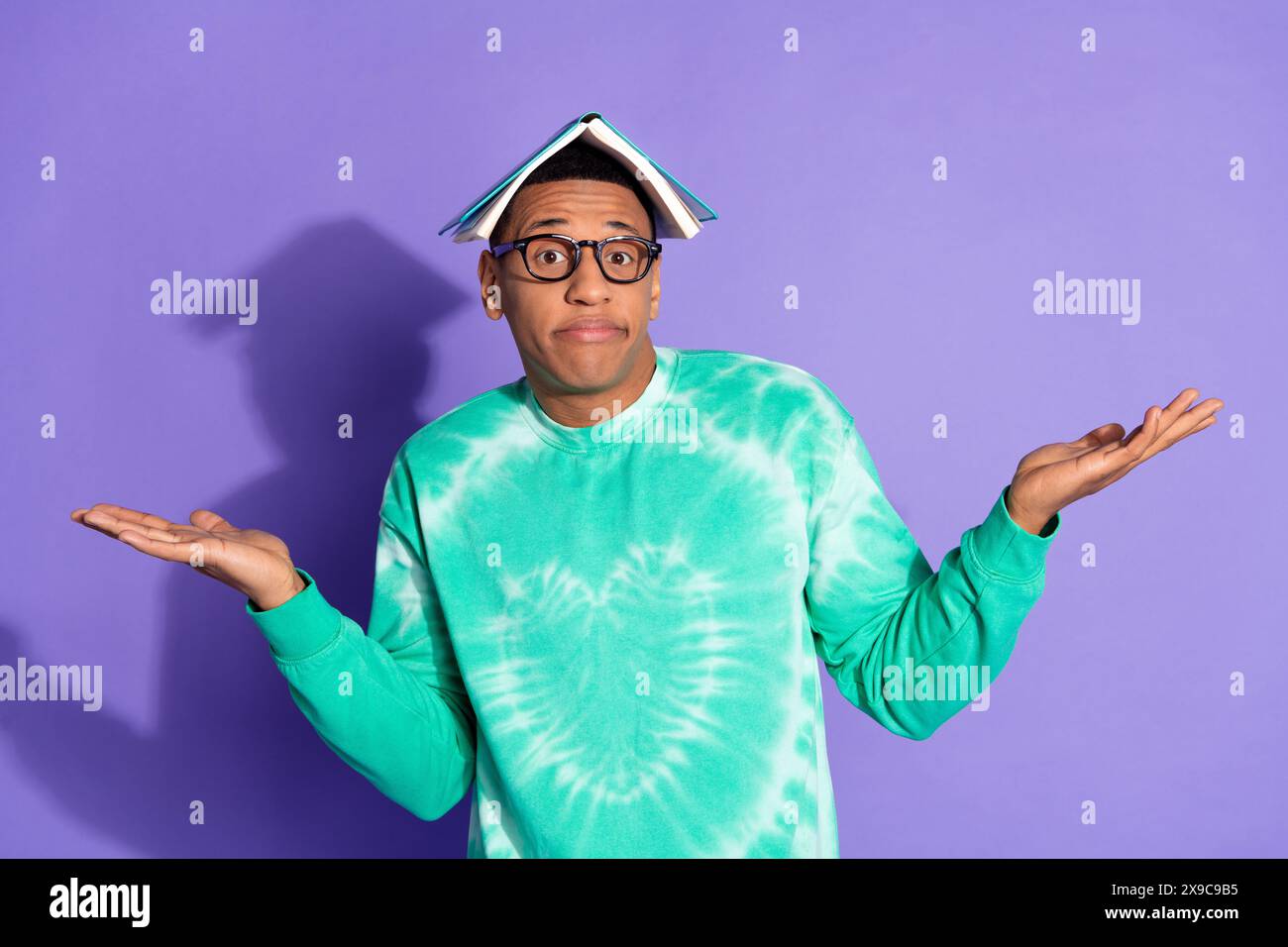 Photo of doubtful unsure guy dressed sweatshirt spectacles holding head ...