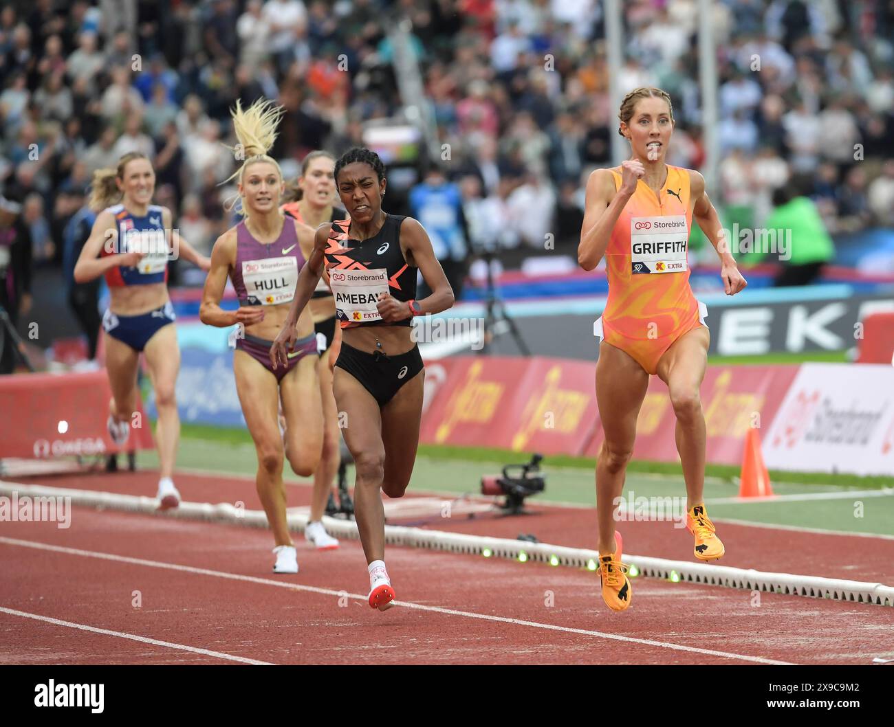 Georgia Griffith runs past Likina Amebaw of Ethiopia in a time of 8:24 ...
