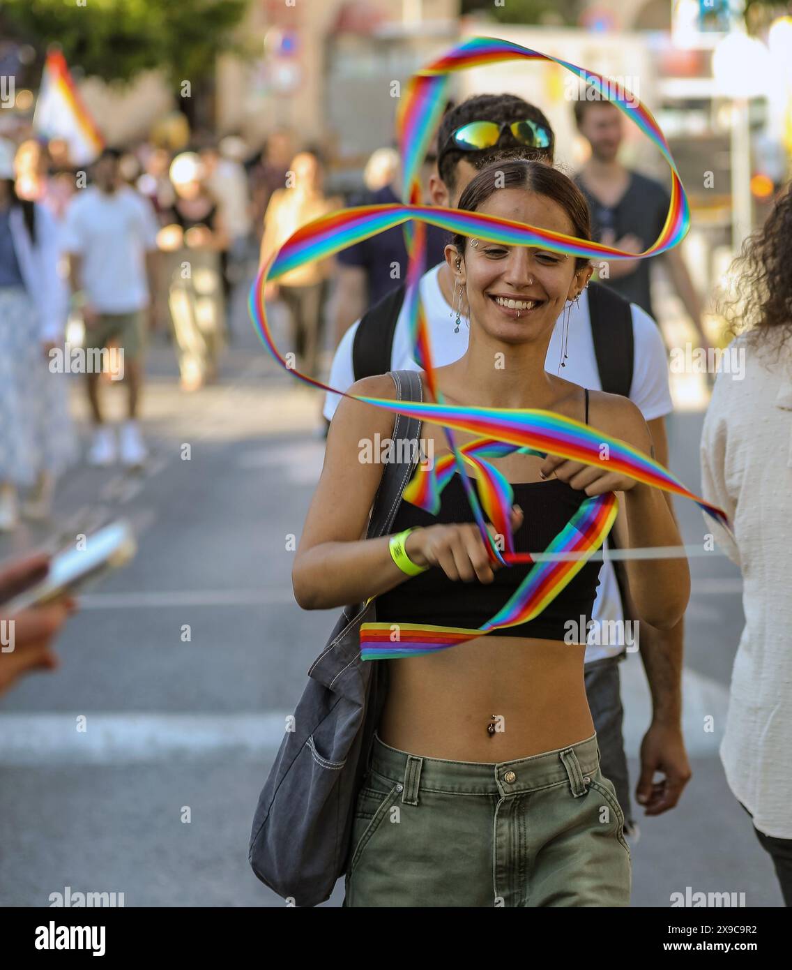 Jerusalem, Israel. 30th May 2024 A smiling maiden dressed in a black ...
