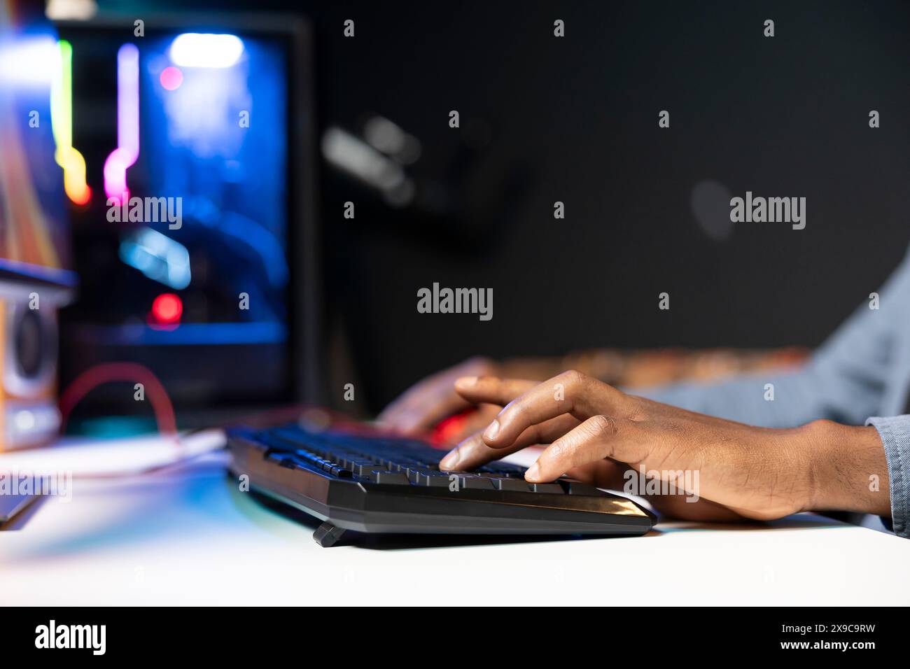 Keyboard used by gamer competing in online multiplayer videogame at ...
