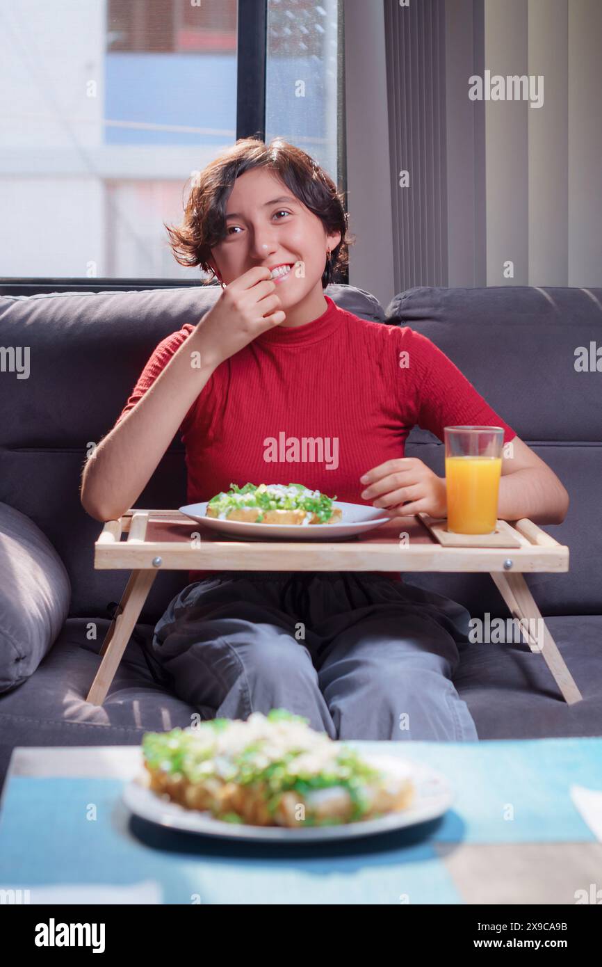 Mexican Taquitos, chicken, cheese and lettuce, Young girl eating ...