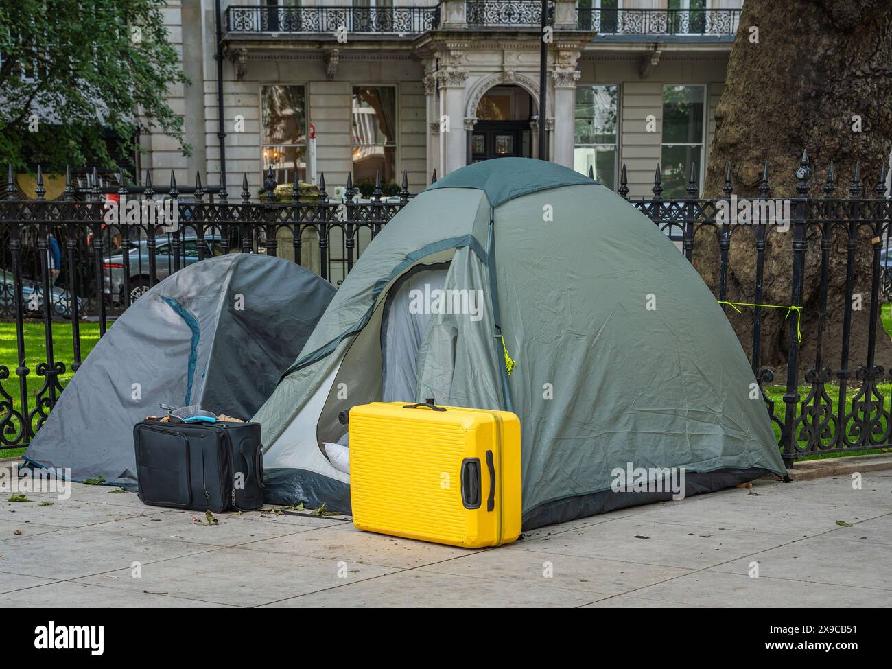 Homelessness in big cities. Tourists or homeless people sleeping in a ...