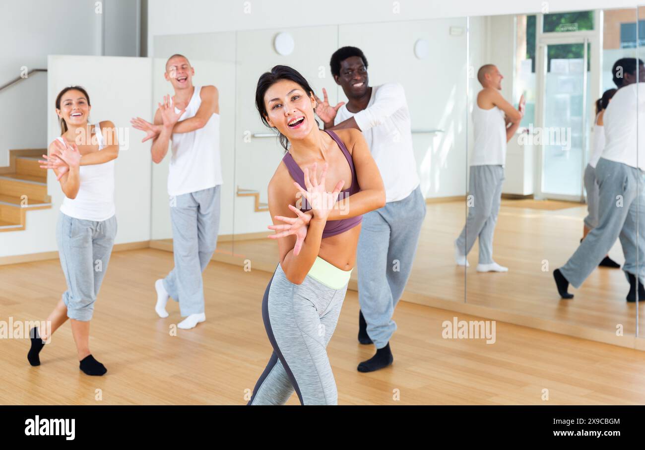 Happy asian woman enjoying active dancing in dance class Stock Photo ...