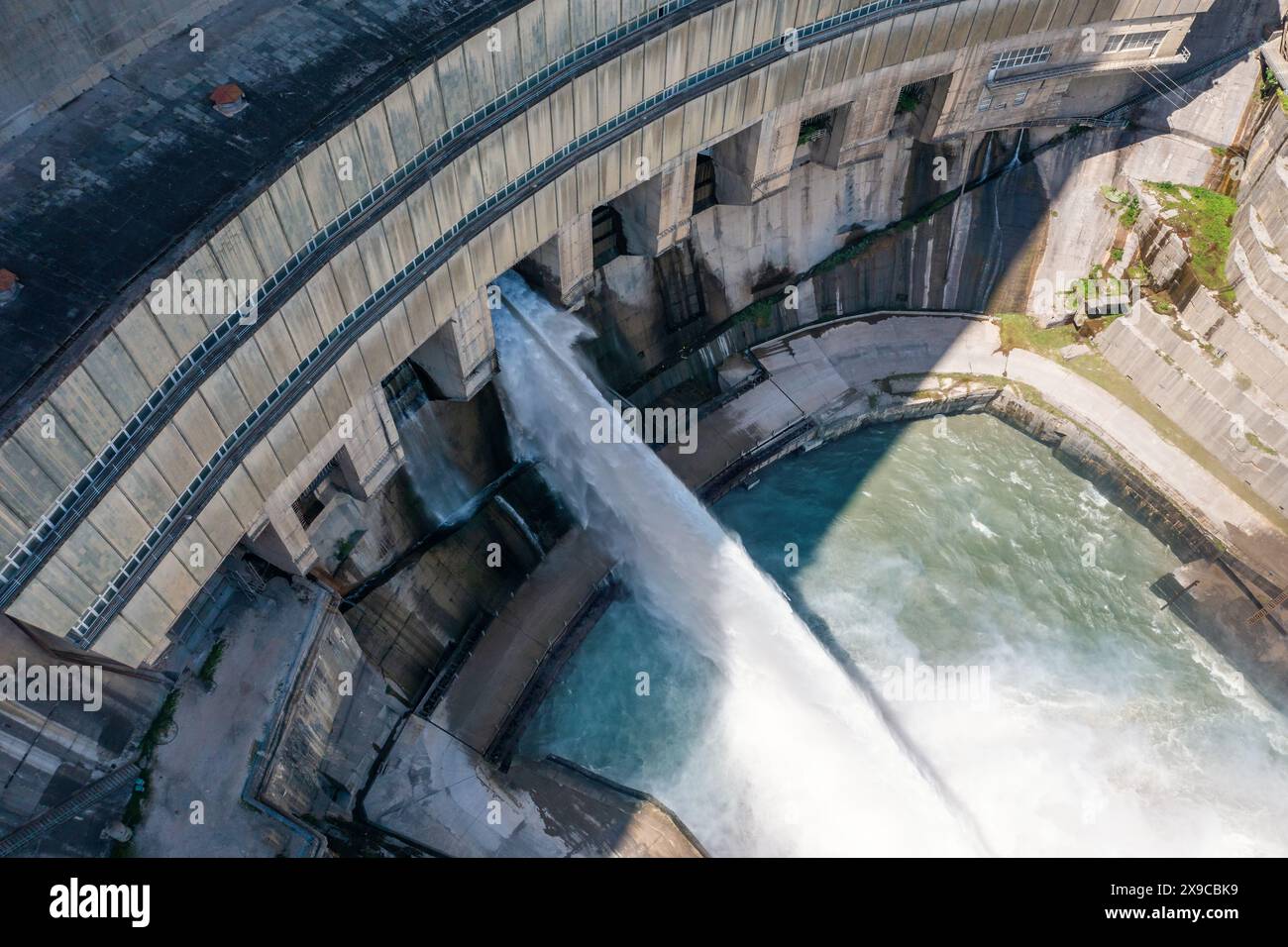 Dam water release, aerial view from drone. Water steam flows from power ...
