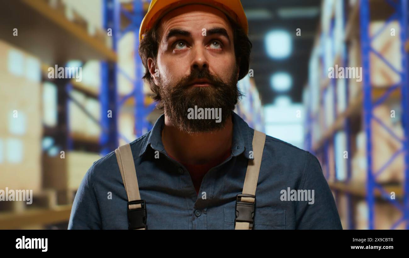 Packaging advisor having merchandise boxes in hands, trying to organize ...