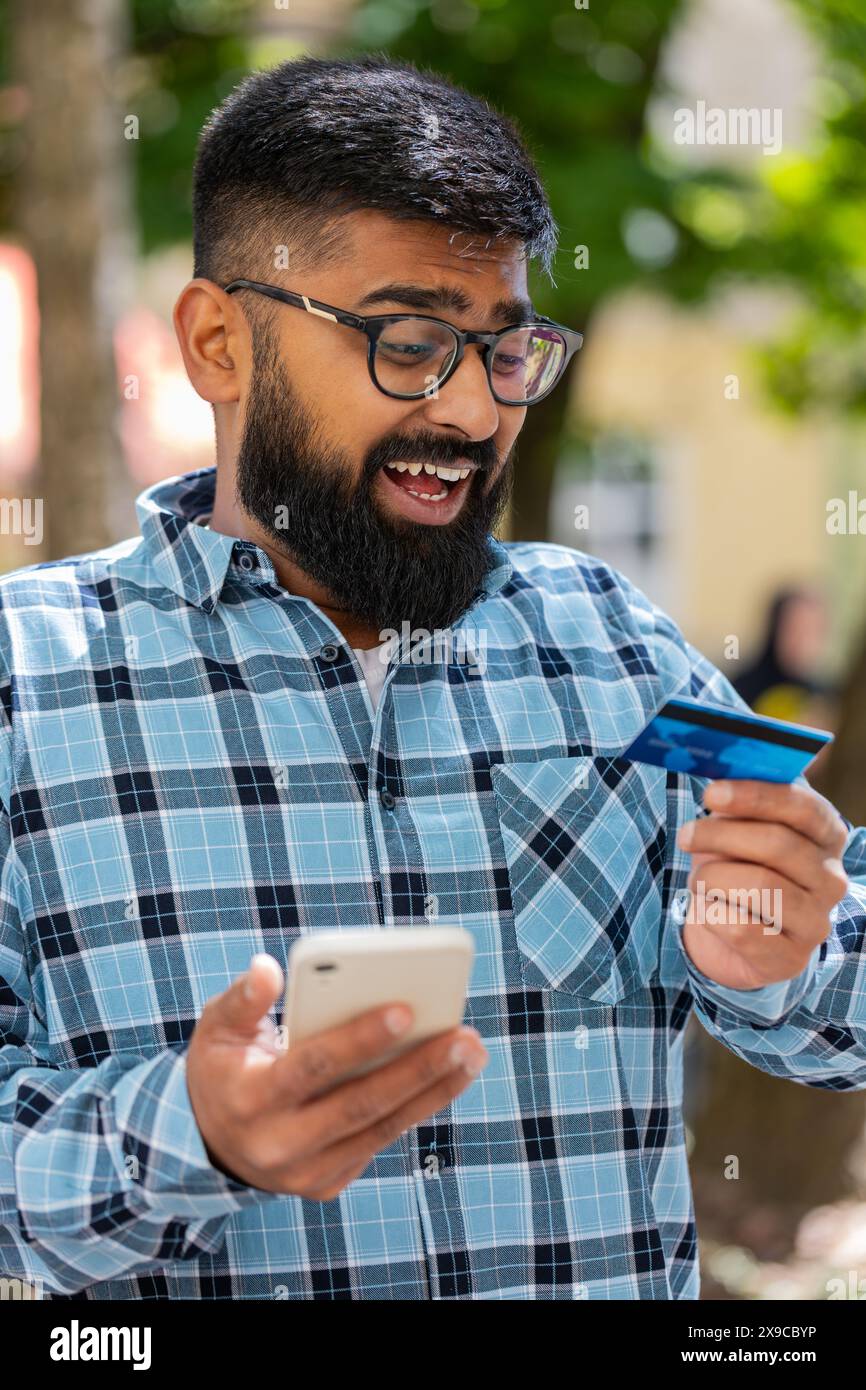 Shocked indian man trying pay hi-res stock photography and images - Alamy