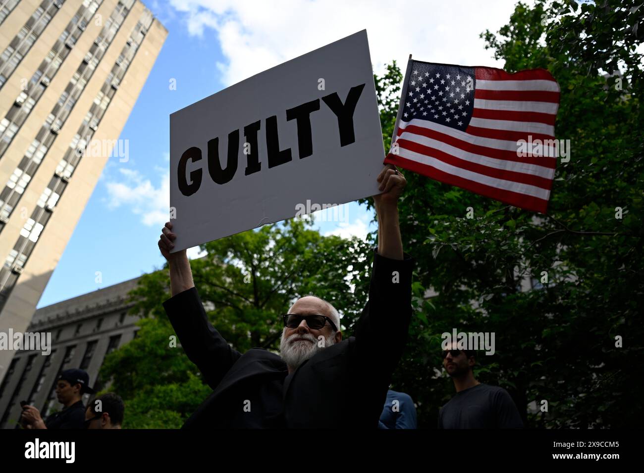 New York, New York, USA. 30th May, 2024. Anti-Trump protester holds ...