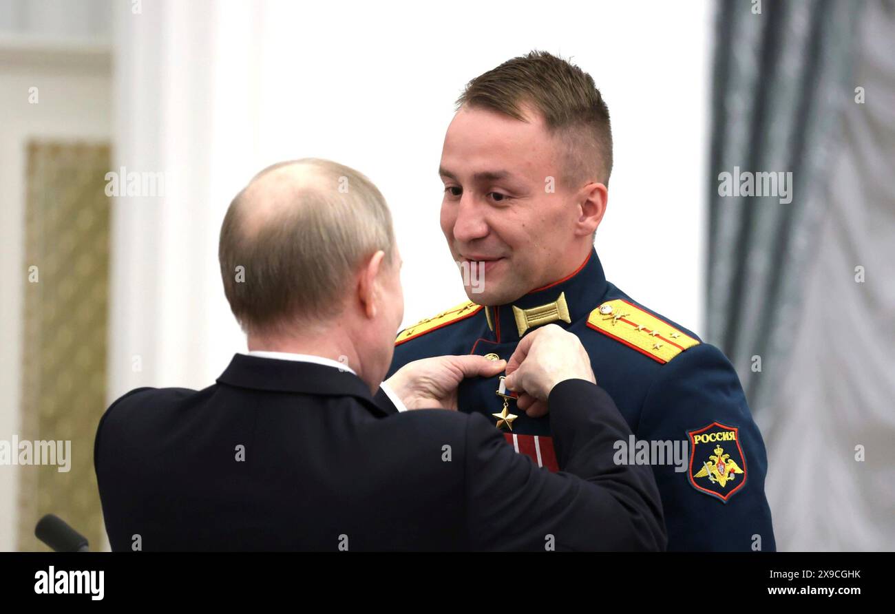 Moscow, Russia. 30th May, 2024. Russian President Vladimir Putin, presents Captain Nikolai ...