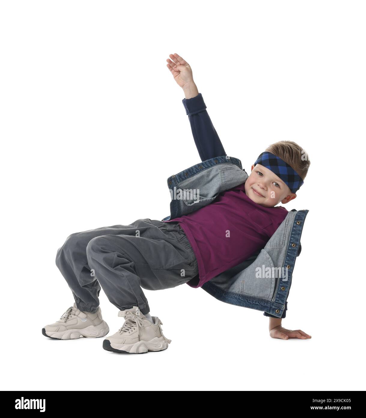 Happy little boy dancing on white background Stock Photo - Alamy