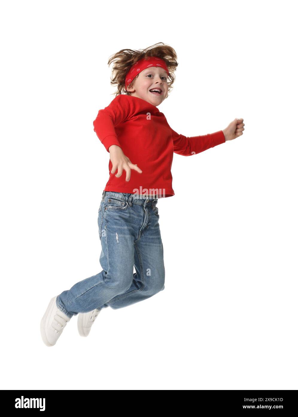 Happy little boy dancing on white background Stock Photo - Alamy