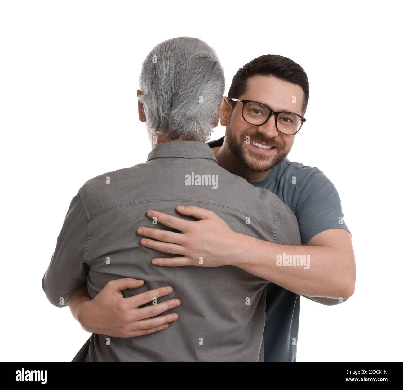 Happy son and his dad hugging on white background Stock Photo - Alamy