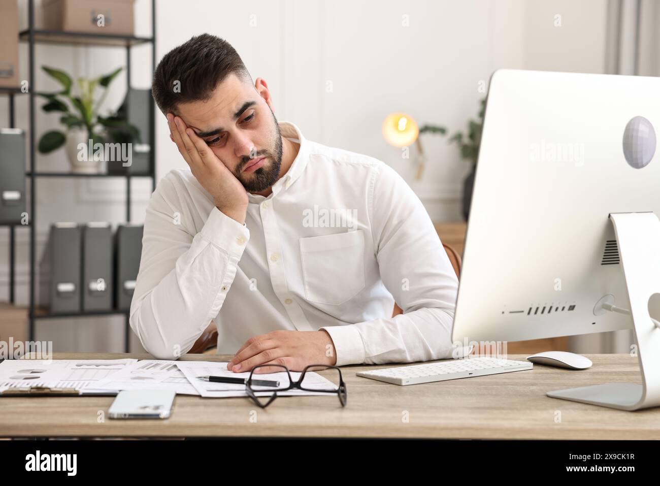 Busy overworked man sitting hi-res stock photography and images - Alamy