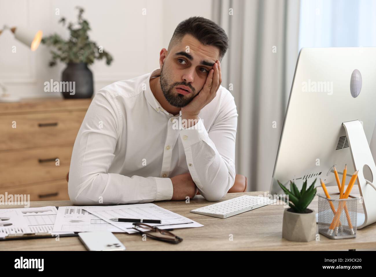 Busy overworked man sitting hi-res stock photography and images - Alamy