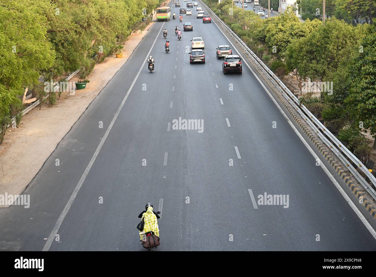 Showcase the six-lane highway stretching into the distance ...