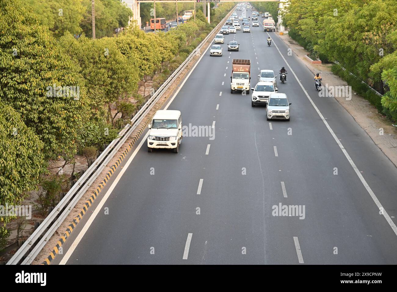 Showcase the six-lane highway stretching into the distance ...