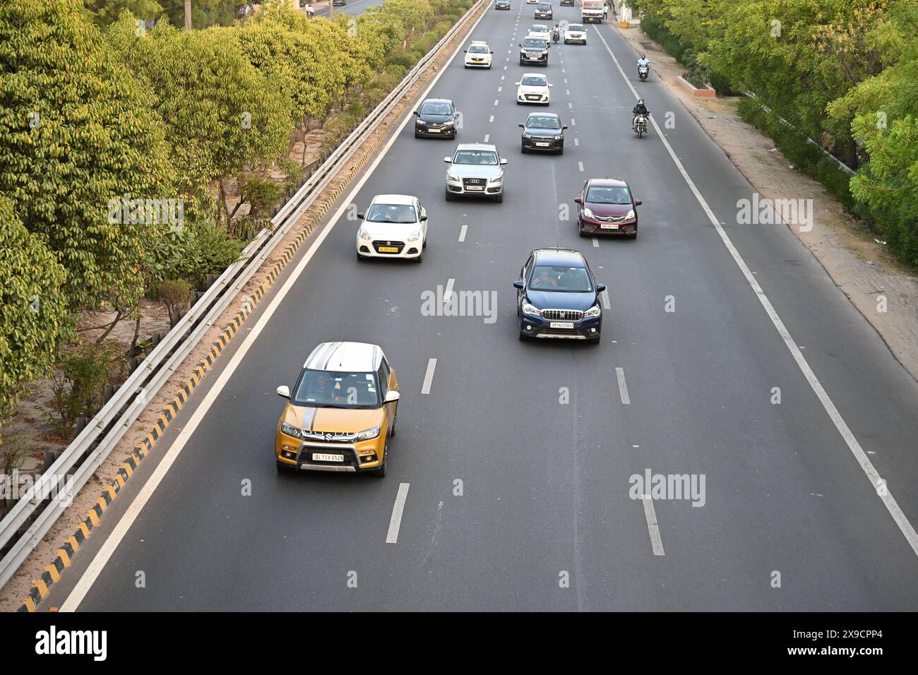 Showcase the six-lane highway stretching into the distance ...
