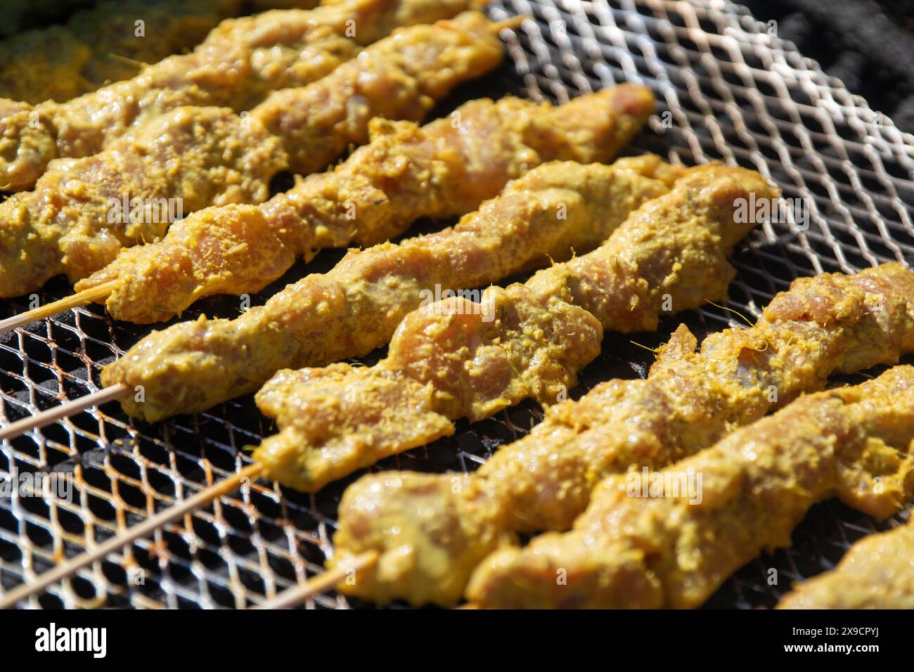 Satay chicken being grilled hi-res stock photography and images - Alamy