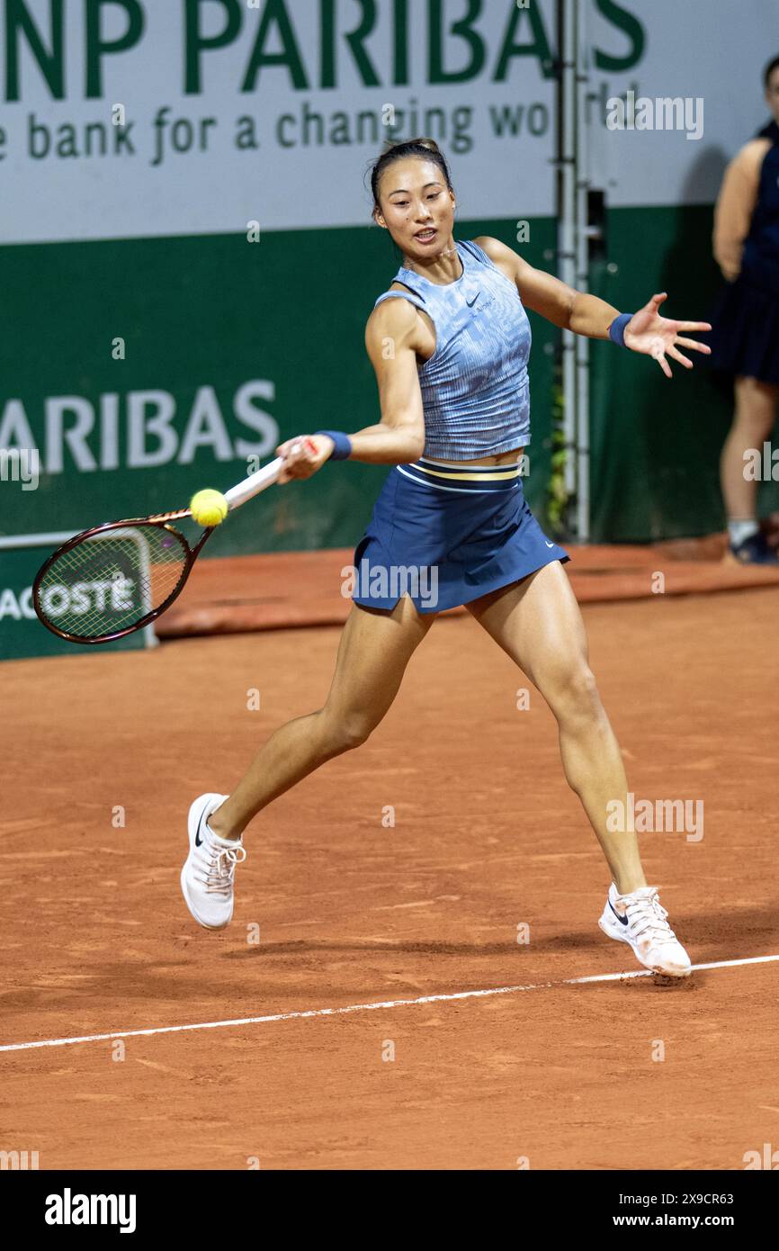 Paris, France. 30th May, 2024. Zheng Qinwen hits a return during the women's singles second ...