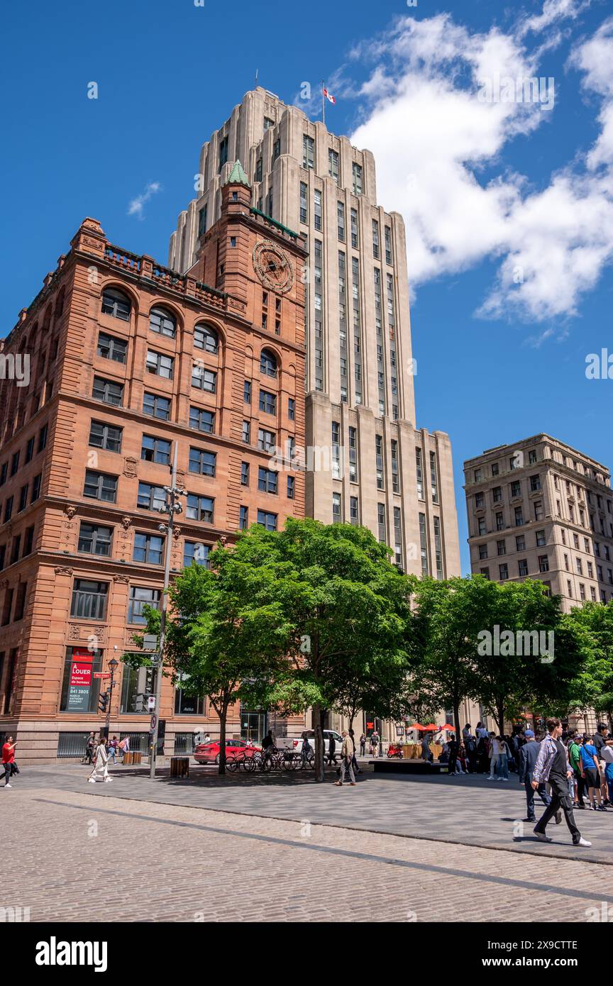 Montreal, Quebec - May 23, 2024: Art deco office tower on Place d'Armes ...