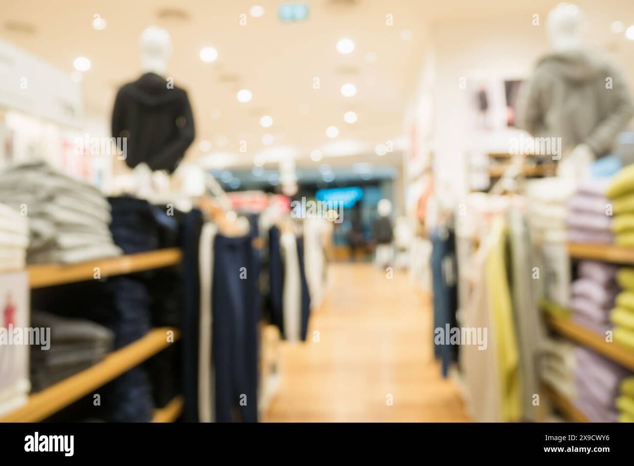Abstract blurred fashion clothing store in modern shopping mall ...
