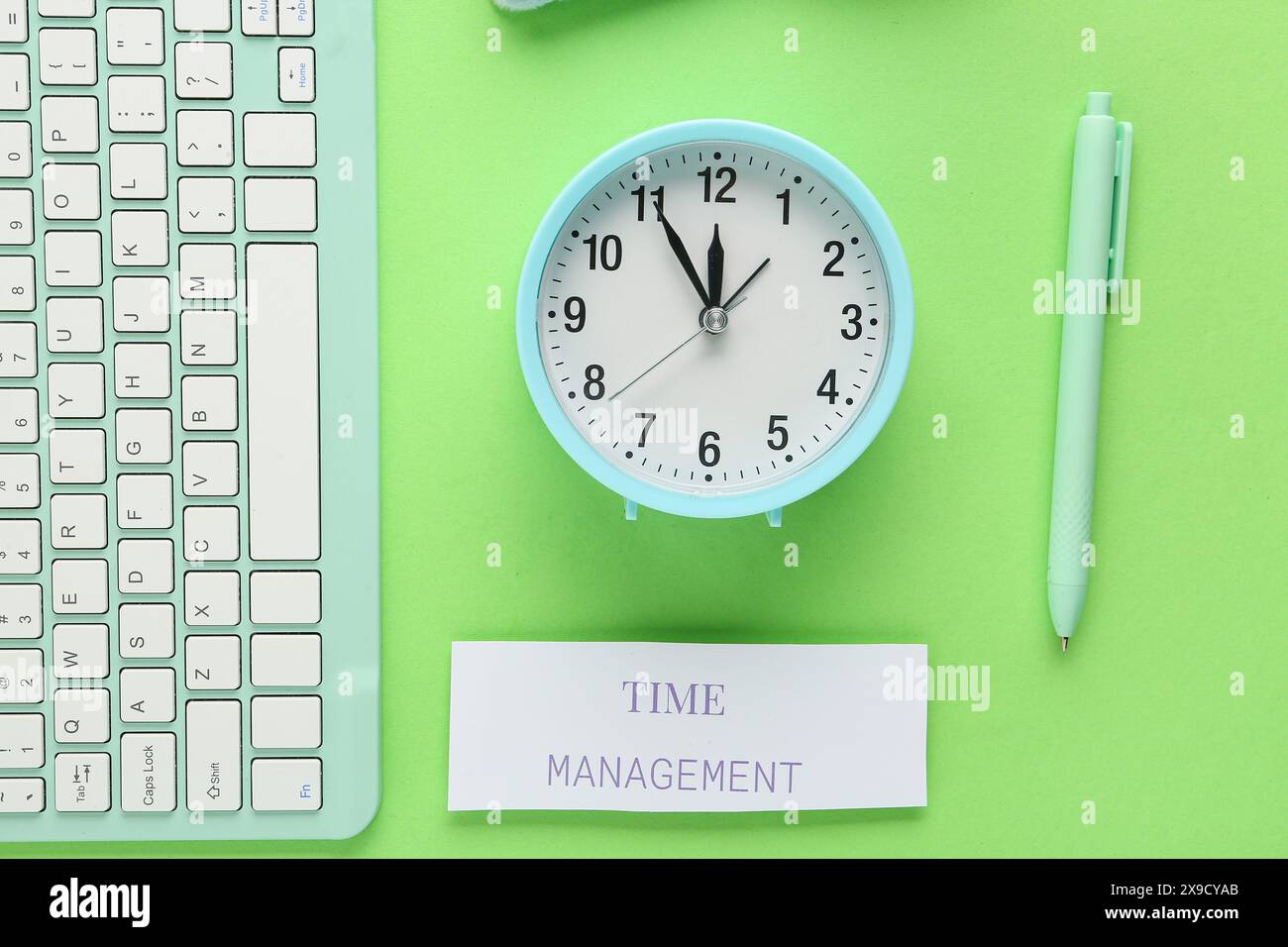Paper with text TIME MANAGEMENT, alarm clock and computer keyboard on ...