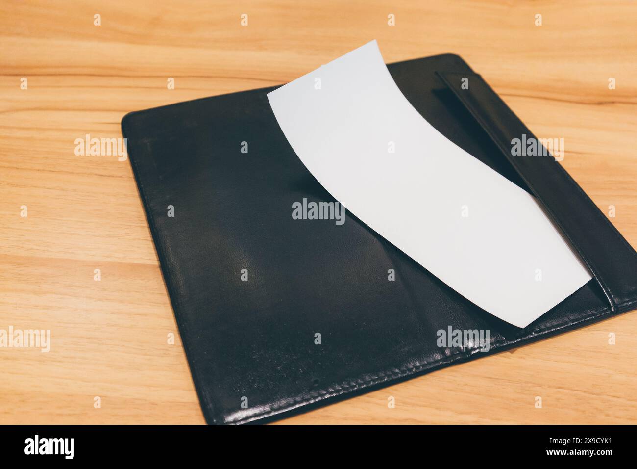 Blank empty white paper in restaurant payment billing receipt folder on ...