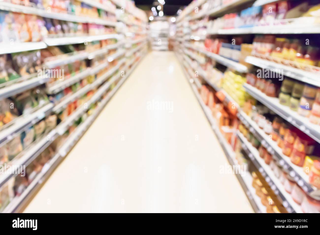 Abstract blur supermarket aisle with can food and snack product on ...
