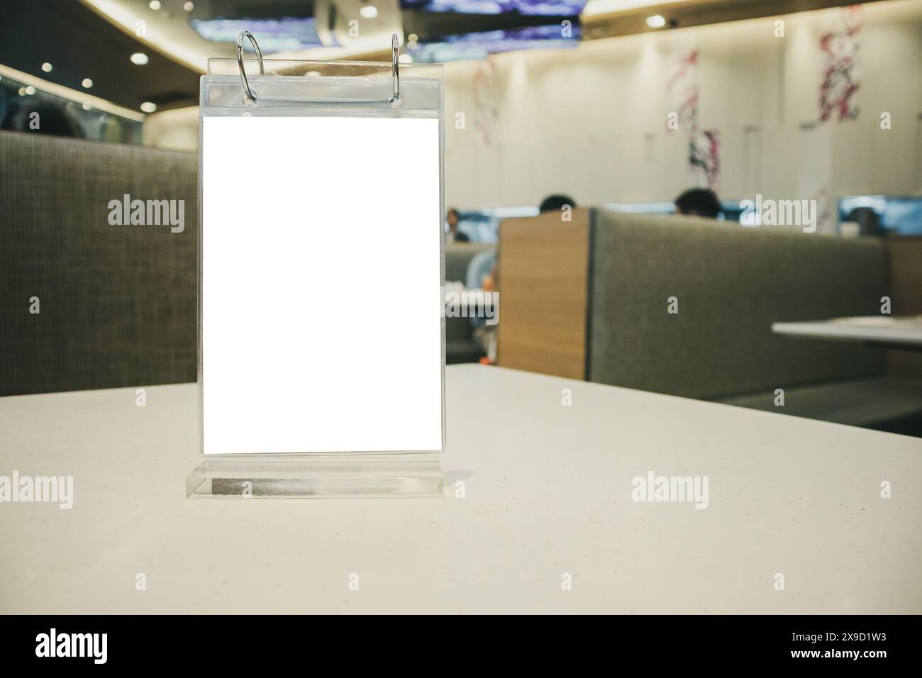Mockup empty white label menu frame on table with cafe restaurant ...