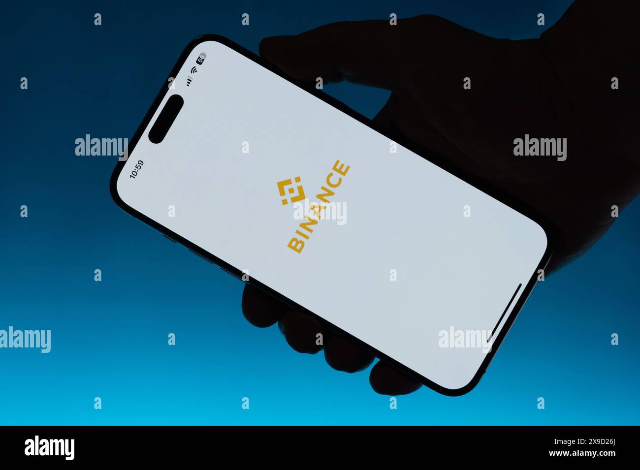 New York, USA - May 6, 2024: Open Binance app on smartphone in hand ...