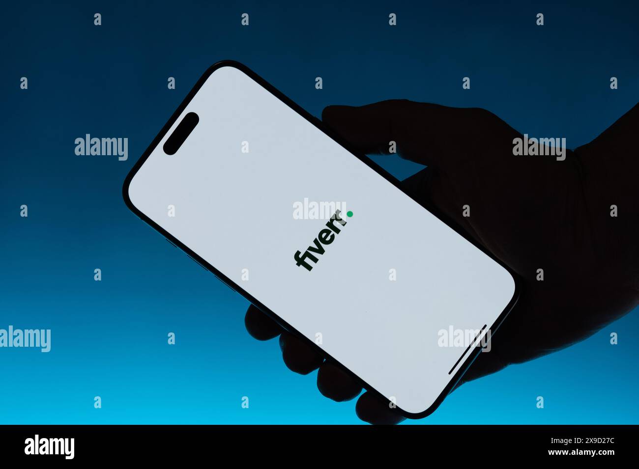 New York, USA - May 6, 2024: Open fiverr app on smartphone in hand ...