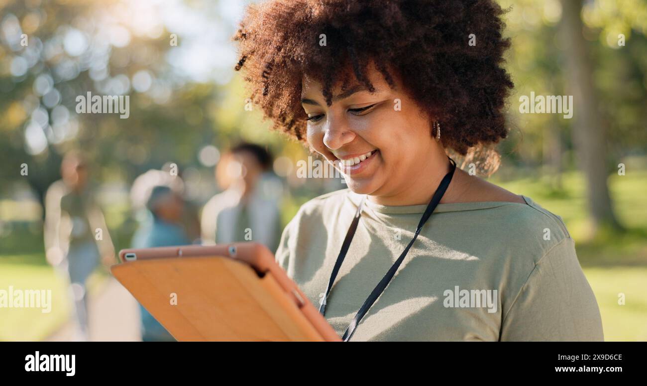 Woman, volunteer and happy nature with tablet in outdoor, community ...