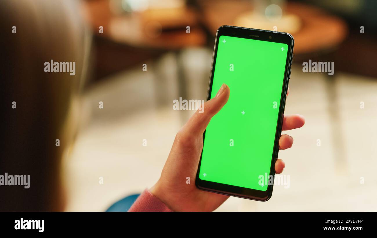 Feminine Hand Scrolling Feed on Smartphone with Green Screen Mock Up ...