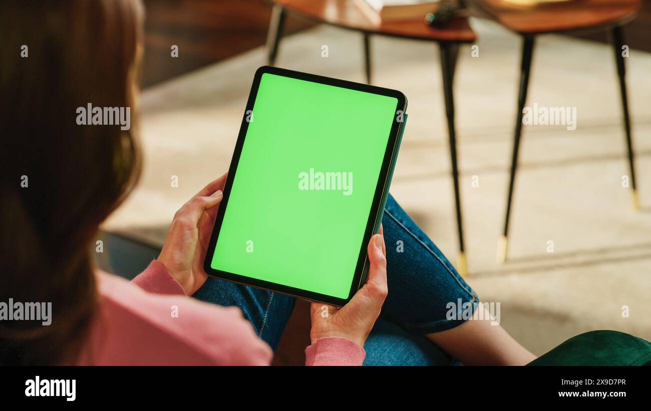Female Scrolling and Tapping on Content on Tablet Computer with Green ...