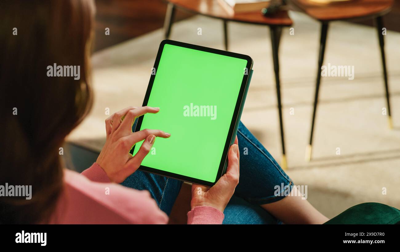 Female professional tapping tablet screen hi-res stock photography and ...