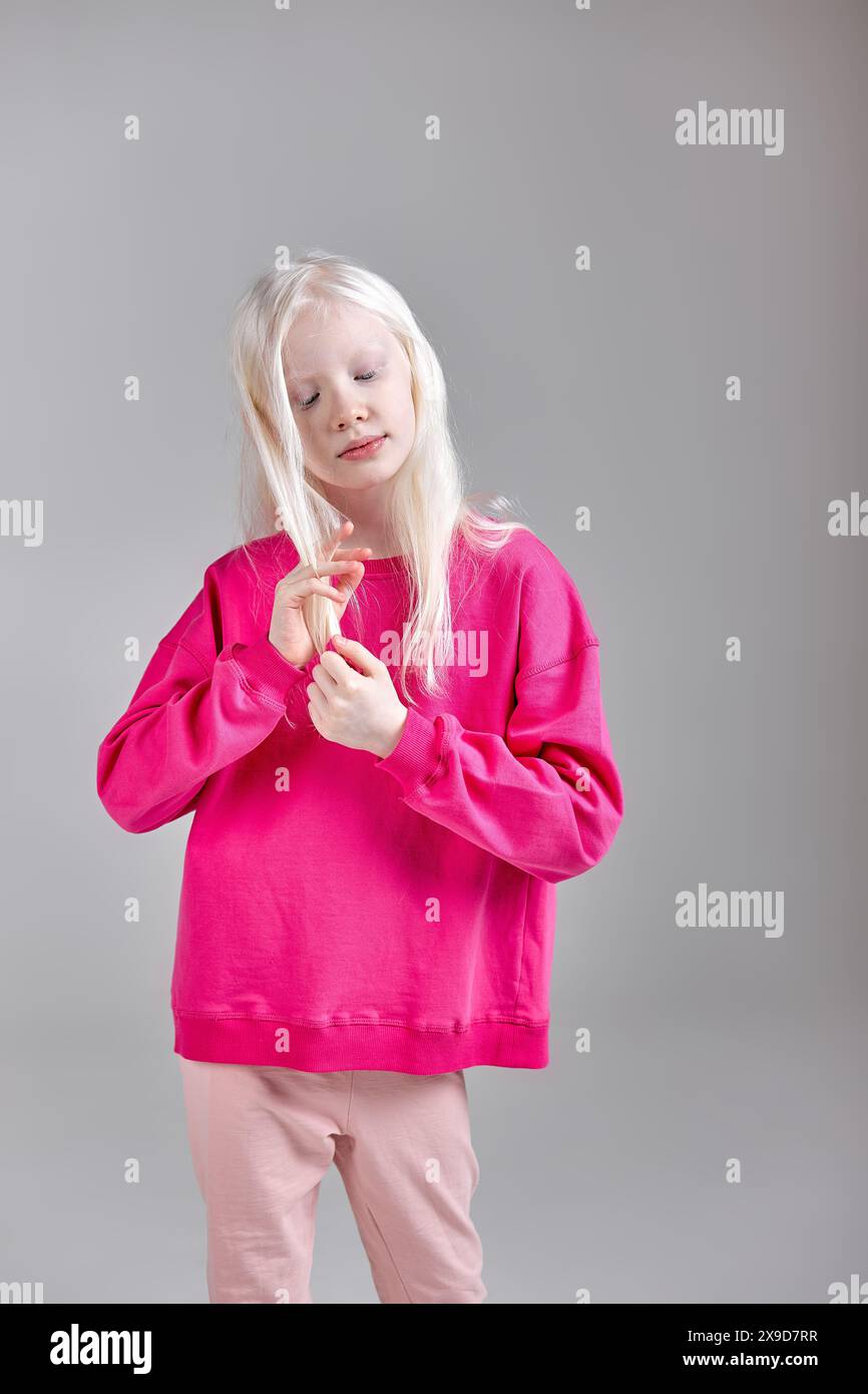 portrait of awesome albino kid with blonde hair. Fashion style and ...