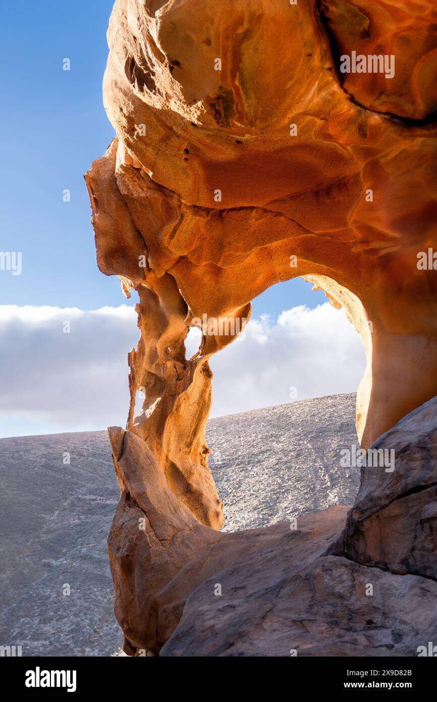 Radiant sunlight illuminates the natural rock formations of Arco de las ...