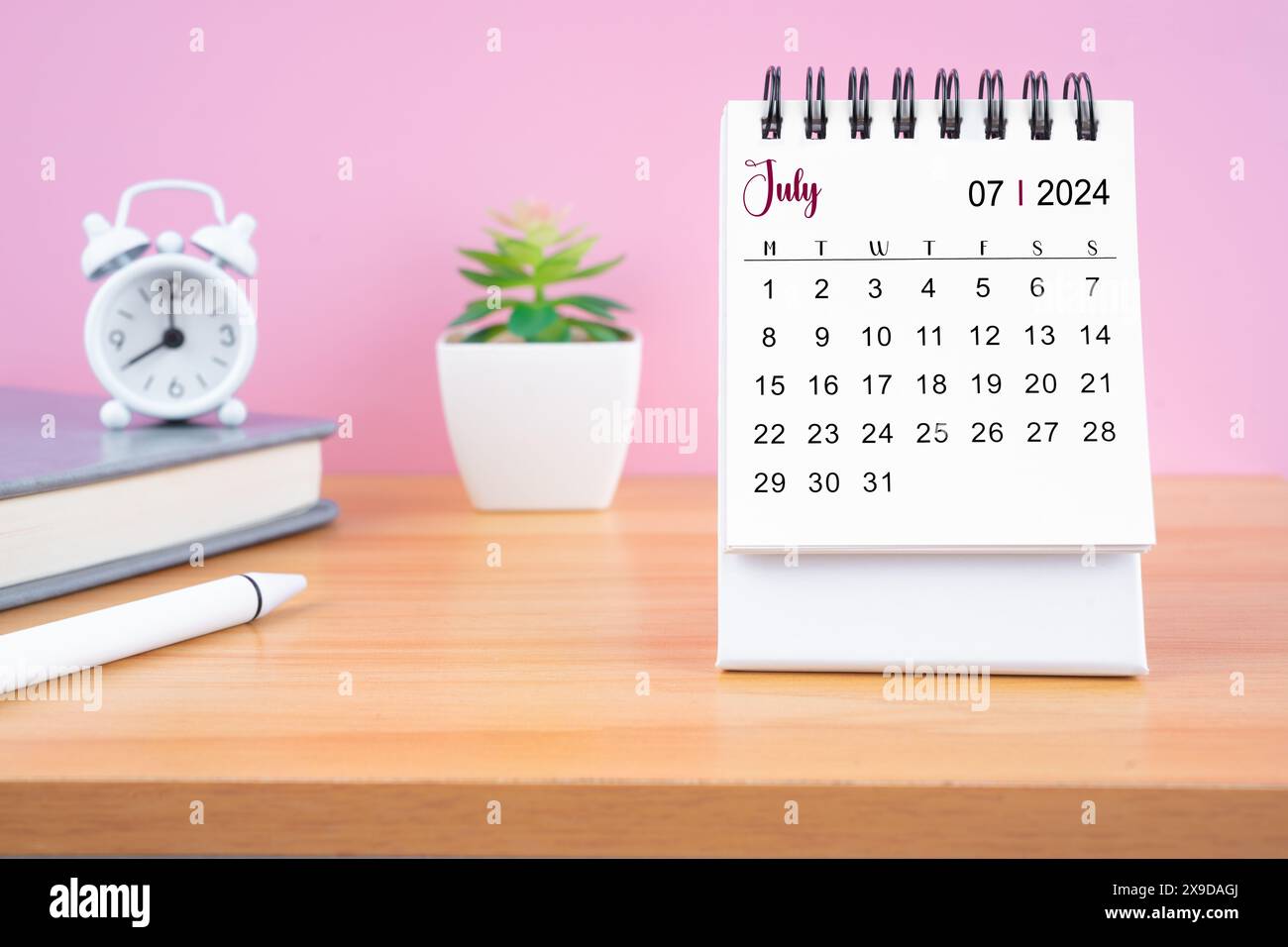 July Mini desk calendar for 2024 year on worktable Stock Photo - Alamy