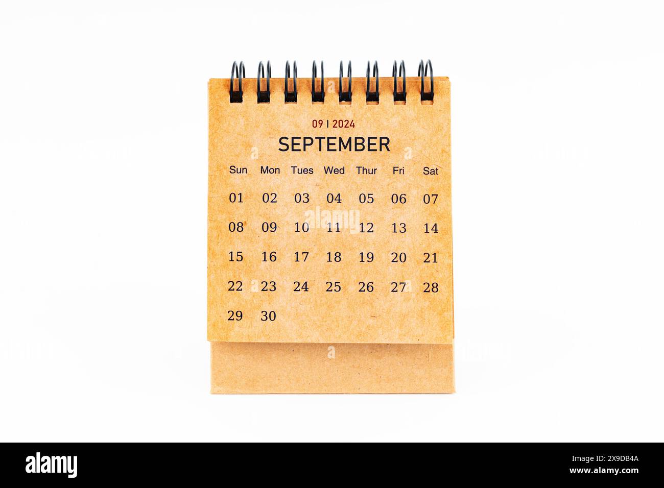 Brown mini desk calendar for September 2024 isolated on white ...
