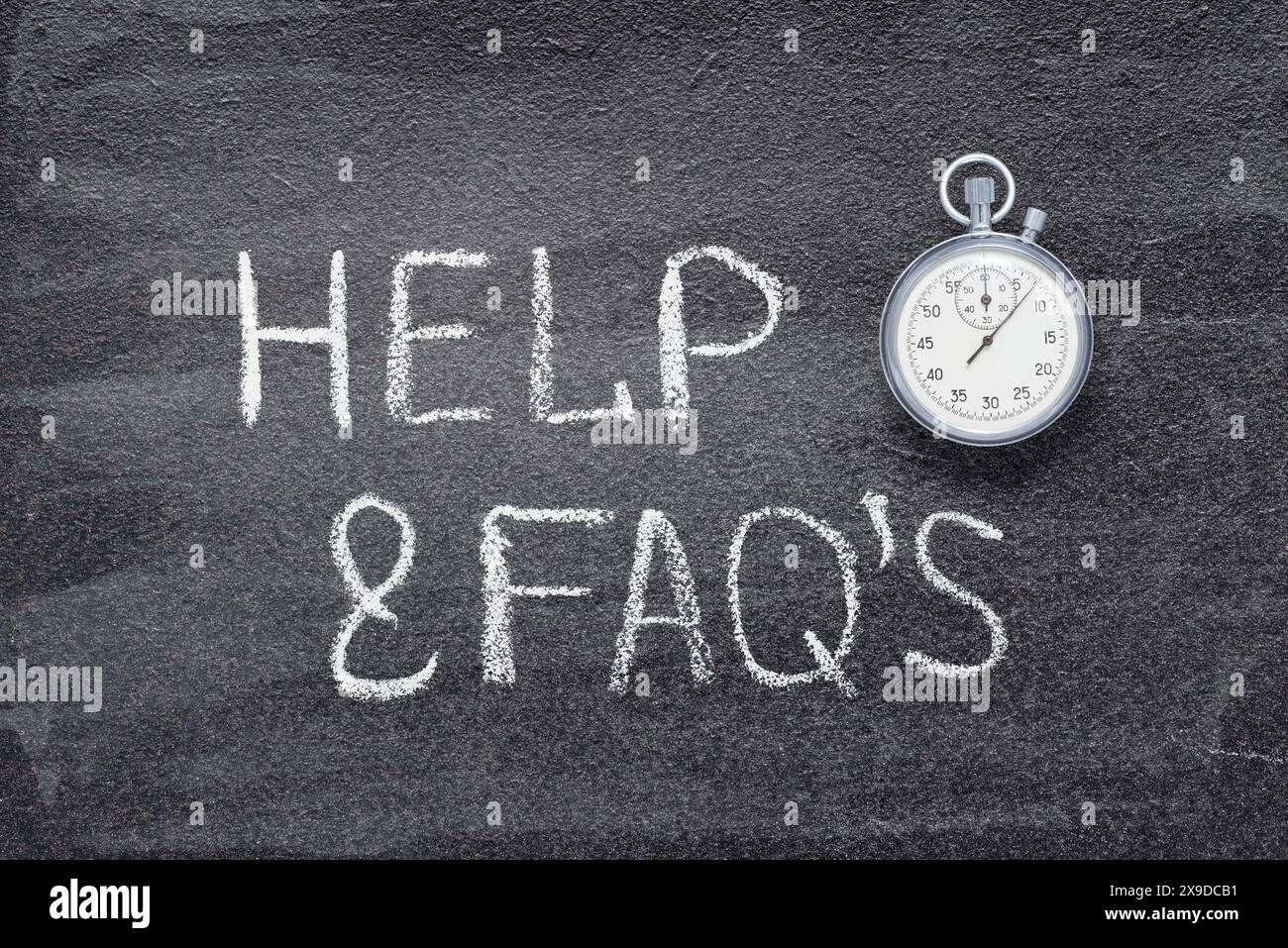 help and FAQ words written on chalkboard with vintage precise stopwatch ...