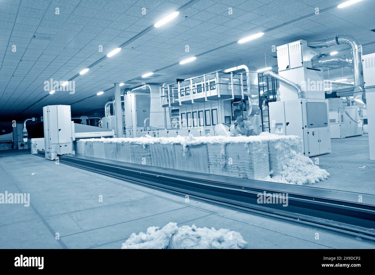 Cotton group in spinning production line factory Stock Photo - Alamy