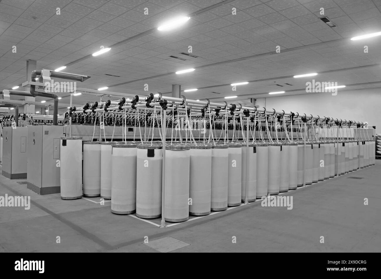 Cotton group in spinning production line factory Stock Photo - Alamy