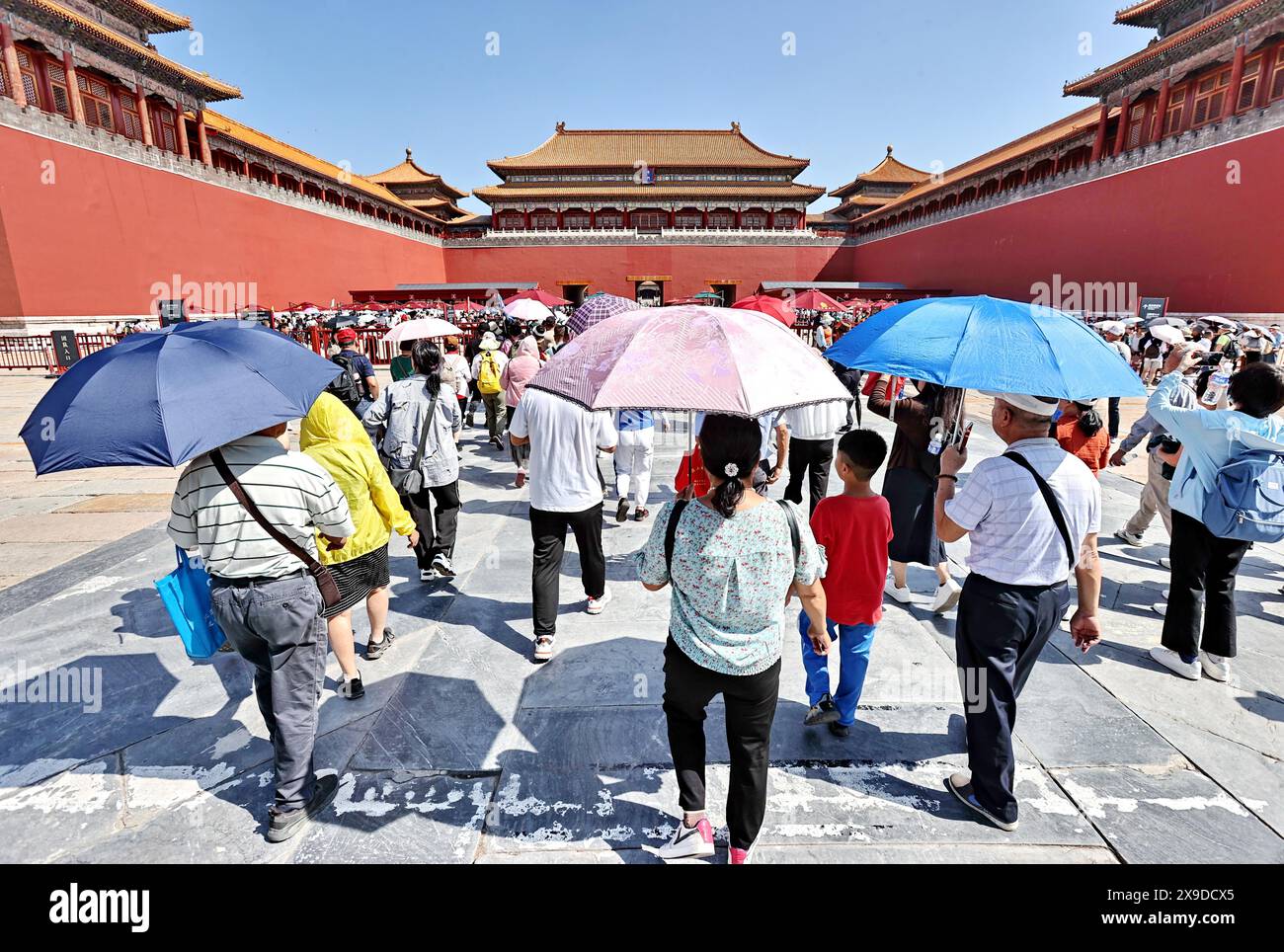 Tourists visit the Palace Museum amid hot weather in Beijing, China, 30 ...