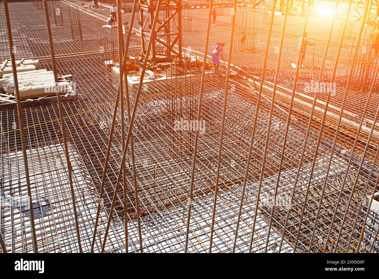 worker in the construction site making reinforcement metal framework ...