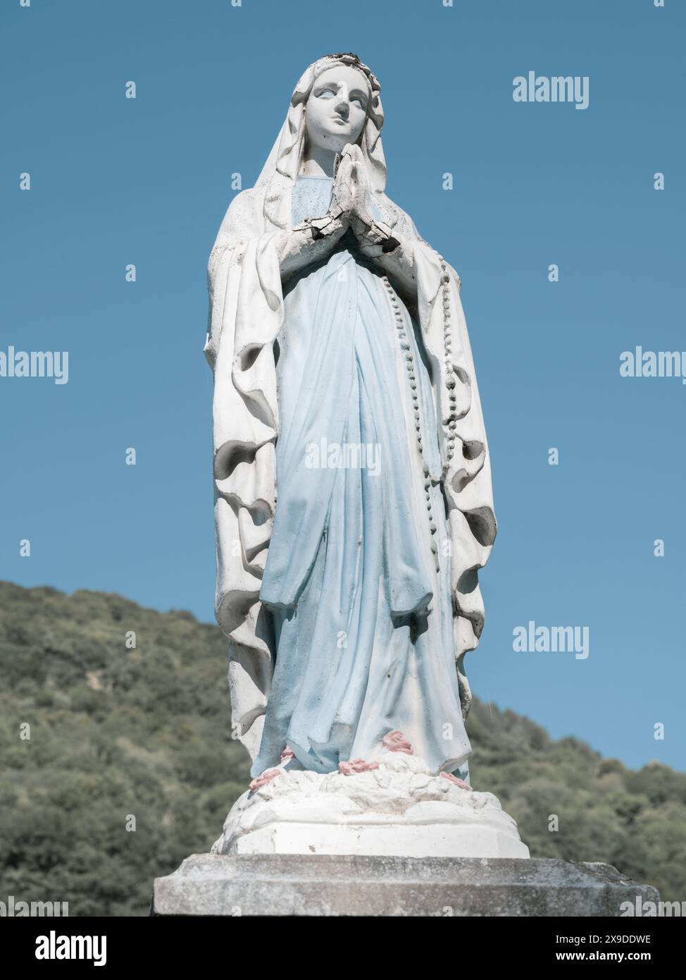 Vintage blue and white praying maria statue in France Stock Photo - Alamy