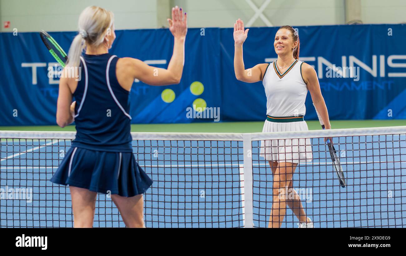 Two Professional Female Tennis Players Shake Hands After Successful ...