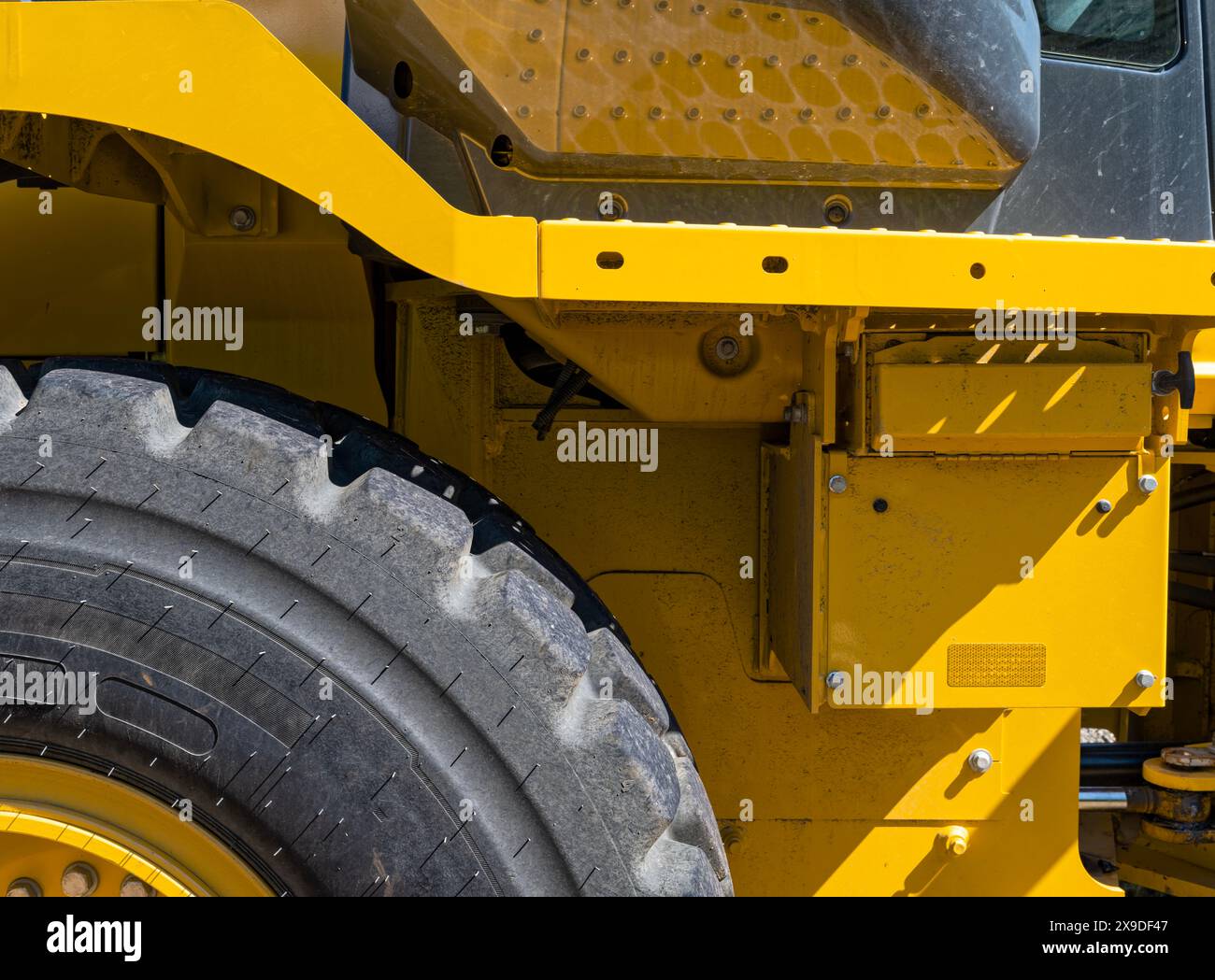 The detail of a section of a tire below the cab of a road grader Stock ...